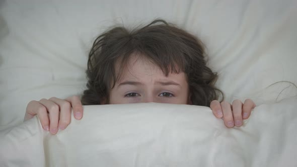 The child is afraid under the covers. , Stock Footage | VideoHive