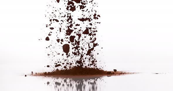 Chocolate Powder falling against White Background, slow motion 4K ...