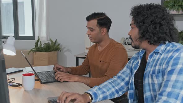 Indian Programmers Talking while Working on Computers, Stock Footage