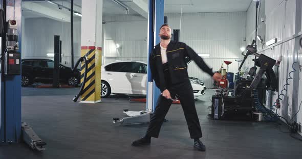 Good Looking Mechanic Man Dancing Excited in Front, Stock Footage ...