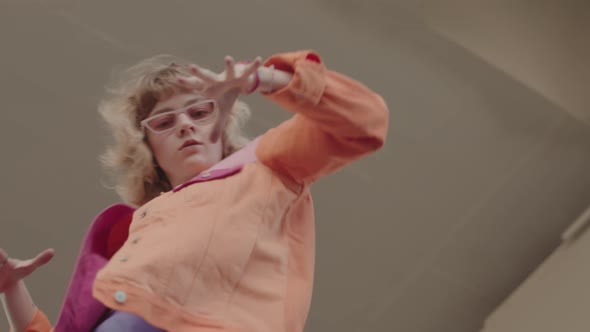 Girl in Y2K Outfit Dancing Vogue, Stock Footage | VideoHive