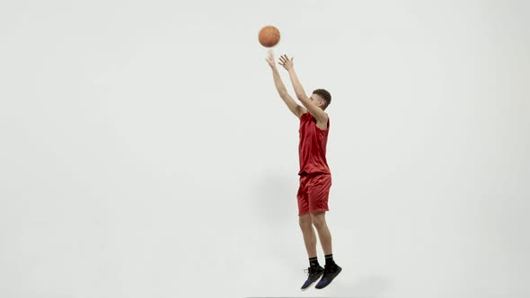 The Basketball Guy Throws the Ball Into the Basket and is Glad That He ...