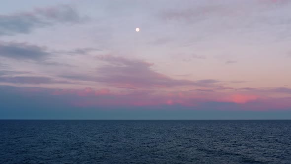 Moon with Ocean and Red Sunset Sky, Stock Footage | VideoHive