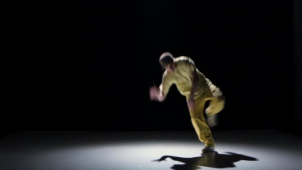 Breakdance Dancer in Yellow Suit Starts Dance on Black, Shadow, Stock ...