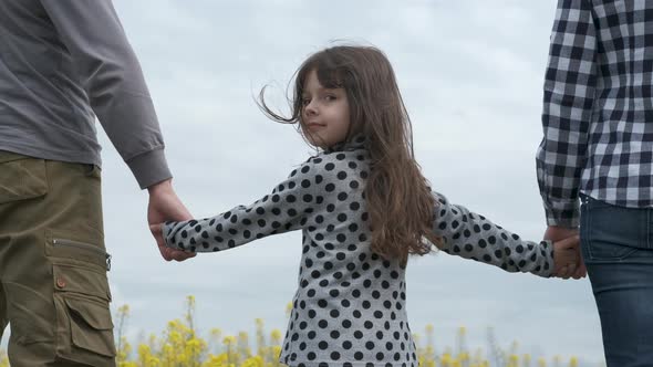 Child hold hands with her parents. , Stock Footage | VideoHive