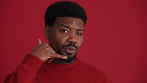 Handsome African man showing call me back gesture, Stock Footage ...