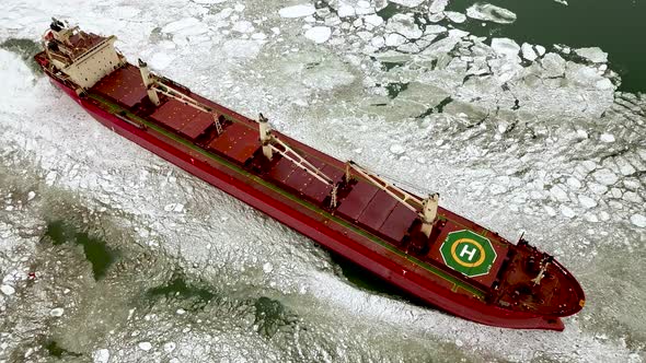 Aerial Above Epic Huge Steel Icebreaker Breaks Ice By Bow of Ship and ...