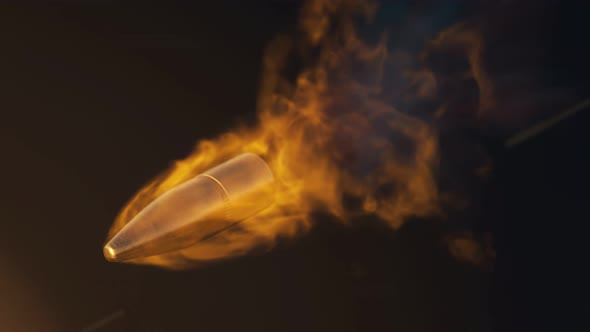 Slow motion shot of shooted bullet with fiery trail. Fire ammunition in ...