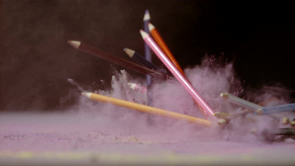 Pencil crayons falling in colorful powder, Ultra Slow Motion, Stock Footage