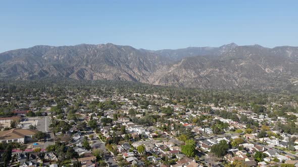 Aerial View Above Pasadena Neighborhood with Mountain on the Background ...
