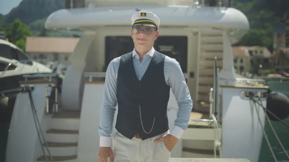 Captain standing in front of boat, Stock Footage | VideoHive