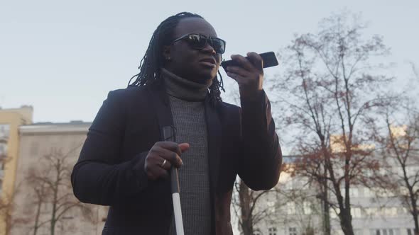 Blind Black African American Man Having a Phone Conversation Outside ...