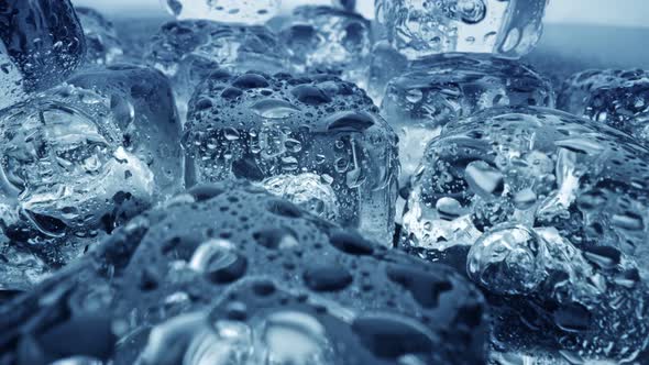 Melted Ice Cubes, Camera Moves Through Ice Cubes with Water Drops Over ...