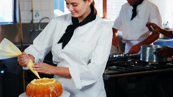 Chef piping icing on cake, Stock Footage | VideoHive