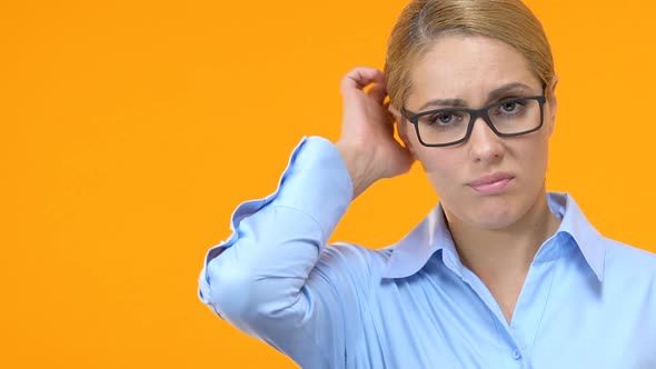 Thoughtful Manager Scratching Head and Shrugging Shoulders, Having No ...