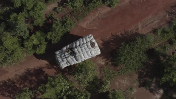 Africa Mali Forest And Road Chasing Loaded Truck Aerial View, Stock Footage