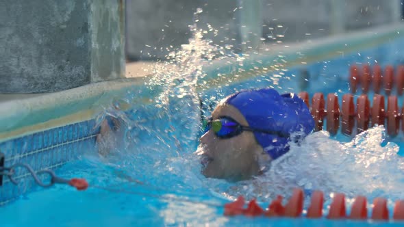Female swimmer disappointed and splashes water in pool 4k, Stock Footage