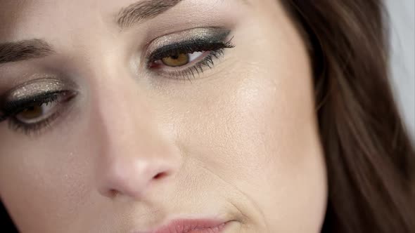 Close up of woman's face as she tilts head., Stock Footage | VideoHive