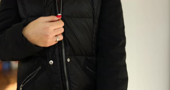 Woman's hand unfasten the zipper on a black jacket, Stock Footage ...