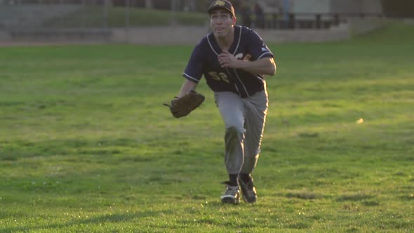 A young man playing catch with a baseball., Stock Footage | VideoHive