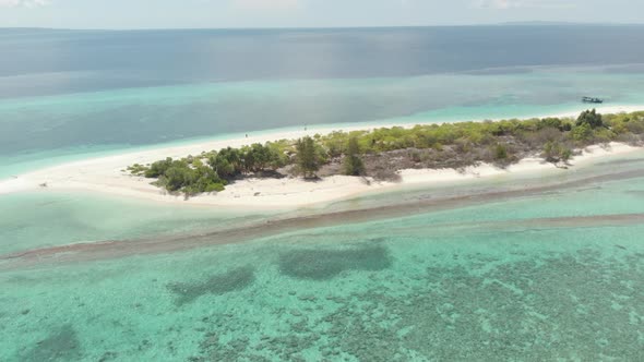 Aerial: Flying over idyllic atoll, scenic travel destination in ...