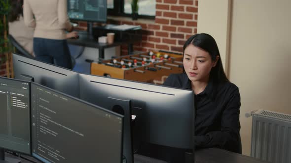 Portrait of Asian Programer Focused on Writing Code Encounters ...