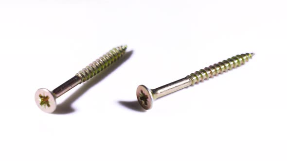 Two Screws Spinning on a White Background, Stock Footage | VideoHive