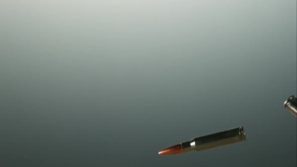 Bullets falling bouncing in ultra slow motion , Stock Footage | VideoHive