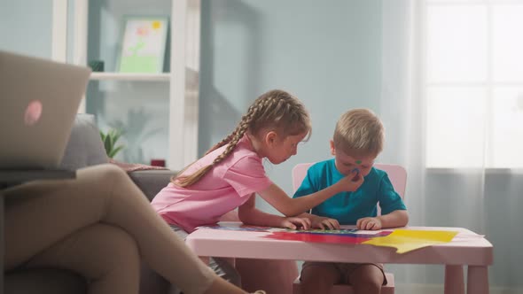 Joyful Children Play with Stickers Stick Stickers on Top of Each Other ...