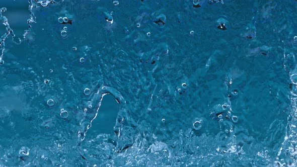Super Slow Motion Shot of Ripping Blue Water Splash at 1000Fps, Stock ...