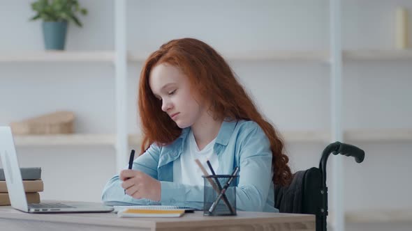 Tired Little Girl with Disability in Wheelchair Studying at Home ...