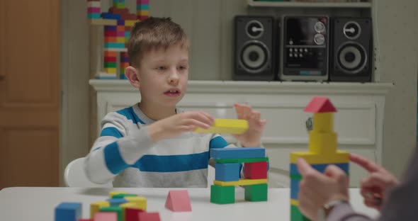 Autistic Boy Building with Color Wooden Blocks, Stock Footage | VideoHive