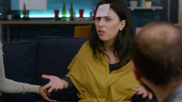 Funny Multiethnic Friends with Sticky Notes on Forehead Enjoying Guess ...