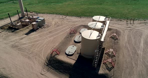 Fracking pad with three large petroleum tanks. June 2022., Stock Footage