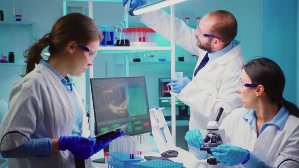 Nurses Analysing Together Virus Mutations Working Overtime, Stock Footage