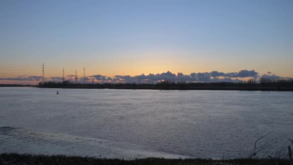 Panoramic static timelapse of Schelde river at dramatic cloudy dawn ...