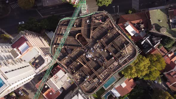 Tradies Working On Building Top Construction Site With Crane, Aerial ...