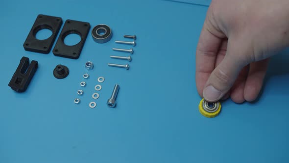 Assembling Small Wheel Bearing Minimalistic Blue Background, Stock Footage