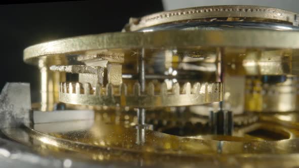 Inside View of a Moving Clockwork of Golden Mechanical Clock on Black ...
