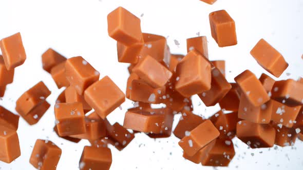 Super Slow Motion Shot of Salted Caramel Explosion Isolated on White ...