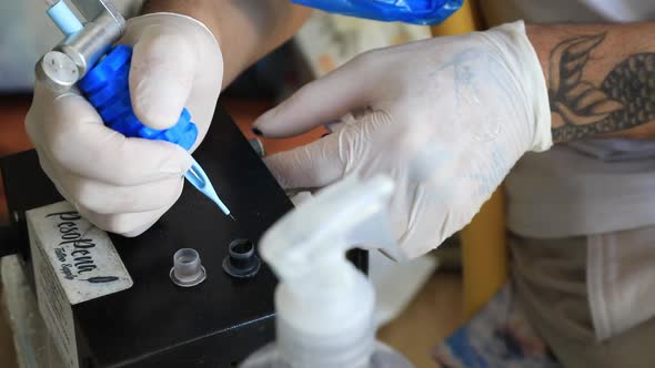 Tattoo artist detail preparation needle on ink, Stock Footage | VideoHive