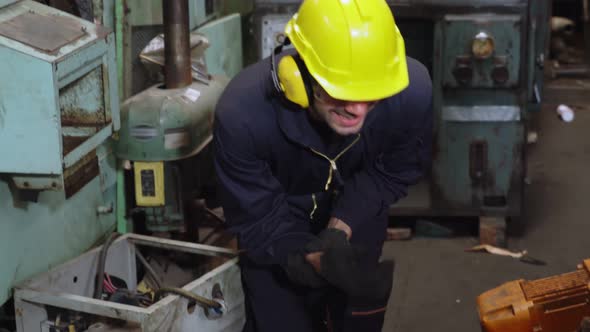 Factory Worker Injured By Accident While Using Machine in Factory ...