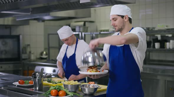 Confident Chef Opening Tray Boasting Served Delicious Seafood on Plate ...