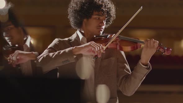 Young Black Man Playing Violin with Piano Accompaniment, Stock Footage
