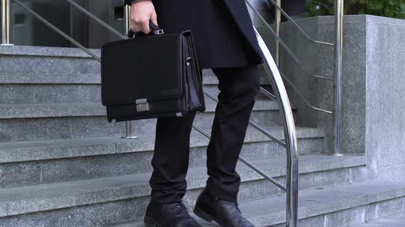 Young Man Sitting Down on Stairs Near Office Center, Feels Exhausted ...
