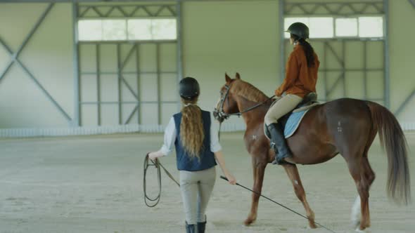 Woman Learning Horseback Riding in Equestrian School, Stock Footage