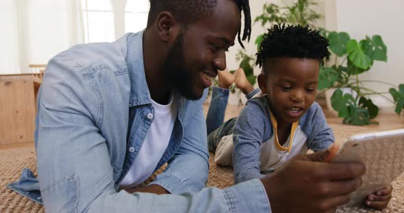 Father and son using technology together at home, Stock Footage | VideoHive