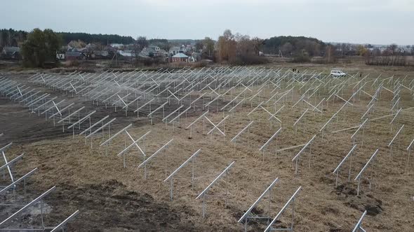Aerial Footage of a Massive Field with Lots of Steel Racks for Solar ...