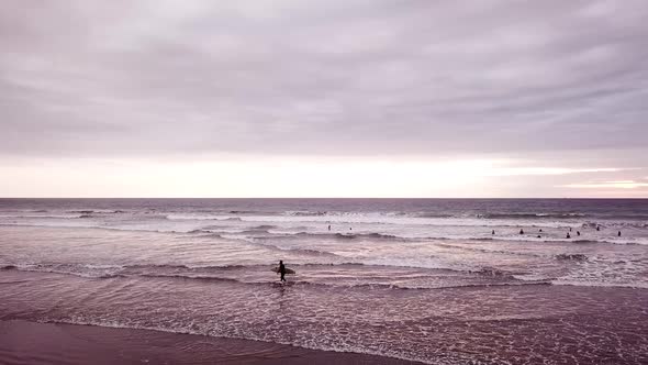 People enjoying the sunset at Olon Beach, Ecuador -aerial, Stock Footage
