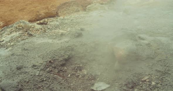Man Stepping Steaming Rocks In Landscape, Stock Footage | VideoHive